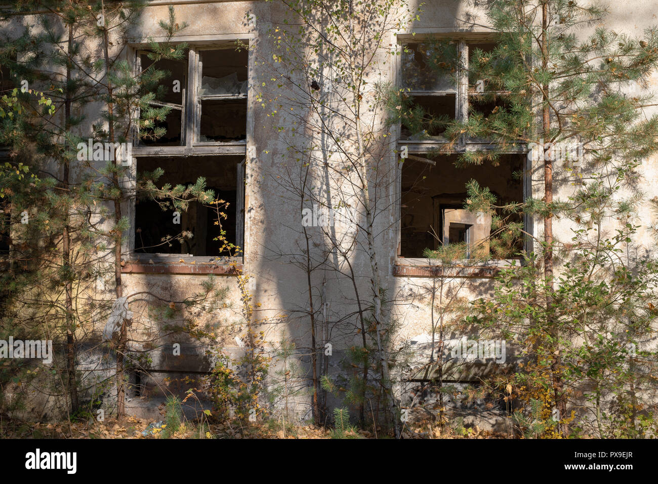 A broken window in an old abandoned building. Broken glass on the ...