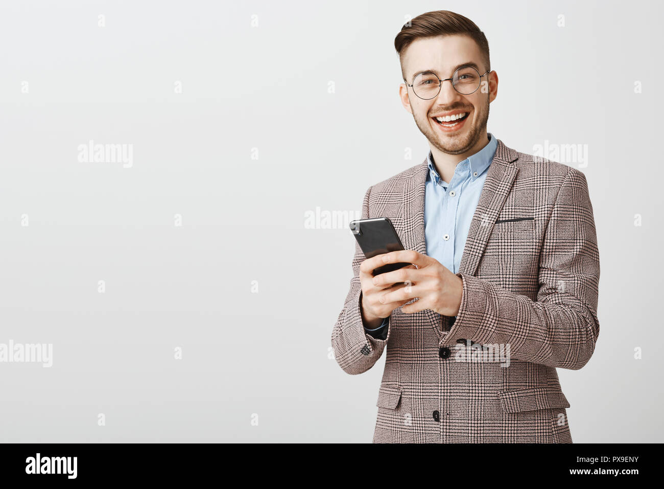 Ambitious good-looking delighted businessman in glasses and stylish ...