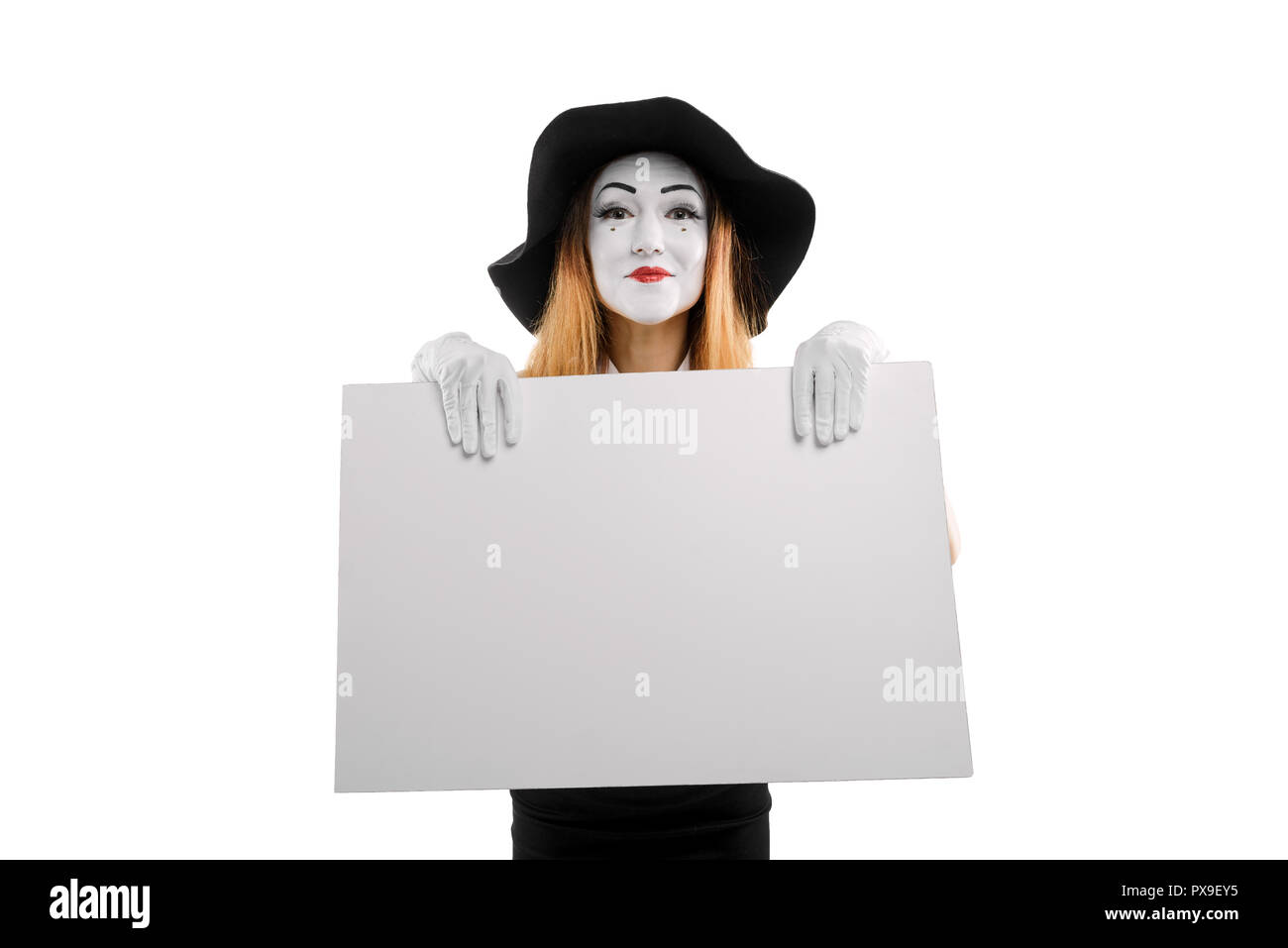 Smiling mime holding empty placard Stock Photo - Alamy