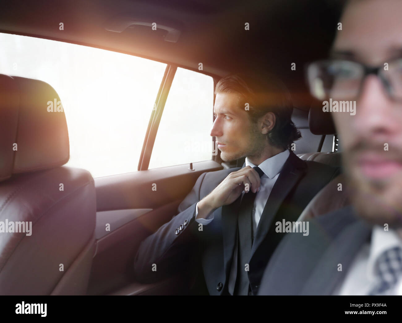business people sitting in a prestige car Stock Photo - Alamy