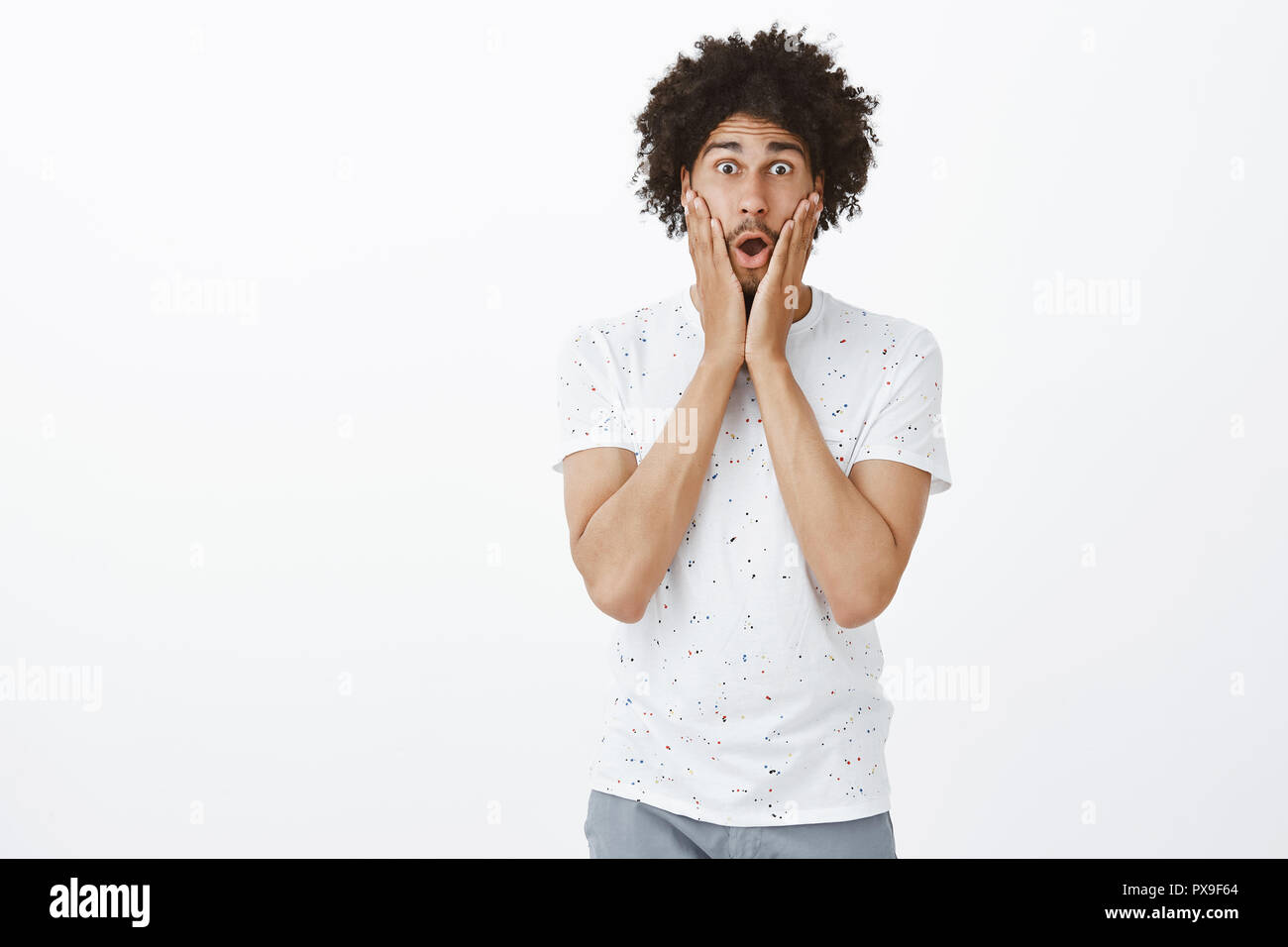 Man shook friend was fired. Shocked and surprised handsome hispanic ...