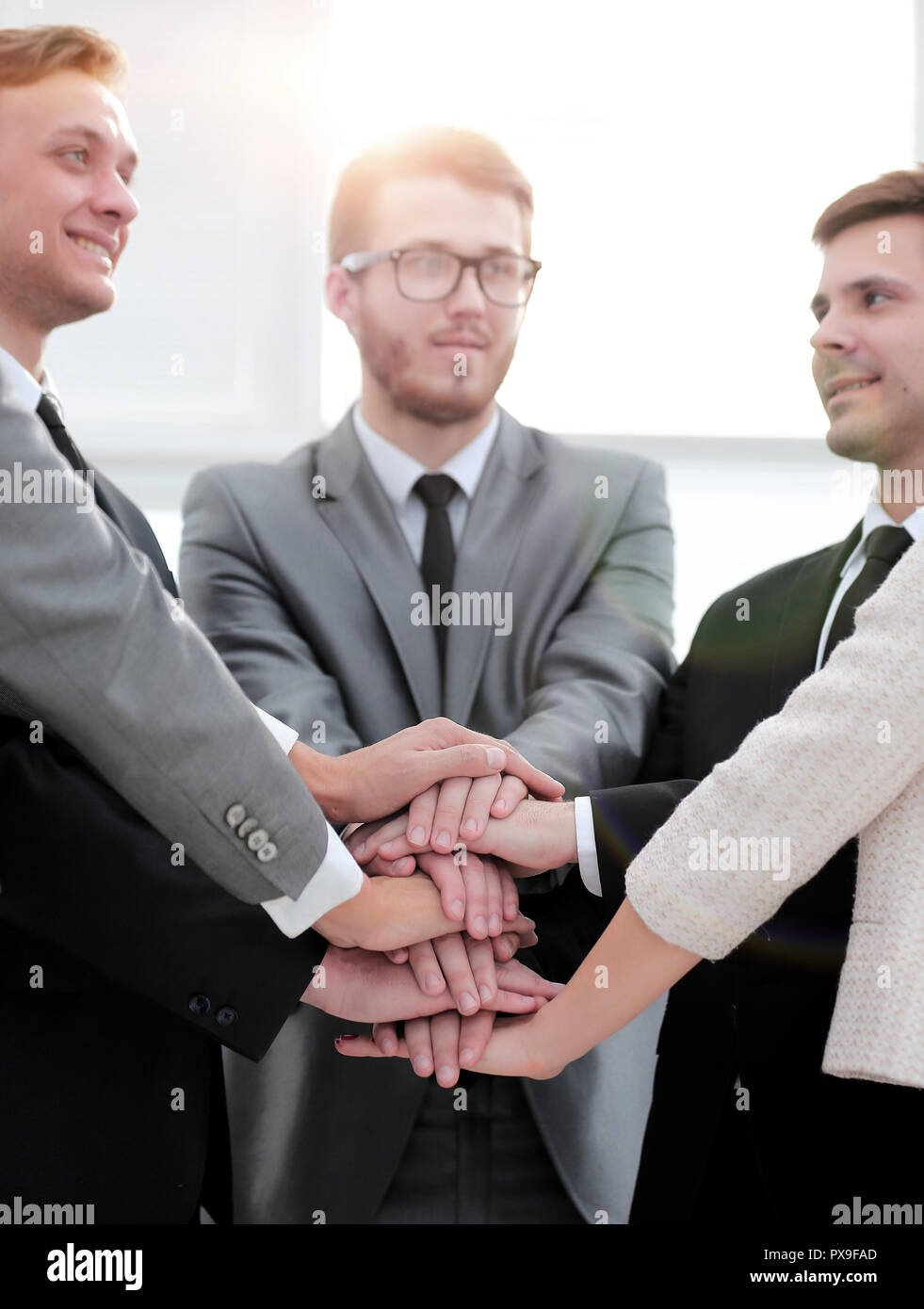 concept of a reliable partnership. business team with folded hands ...
