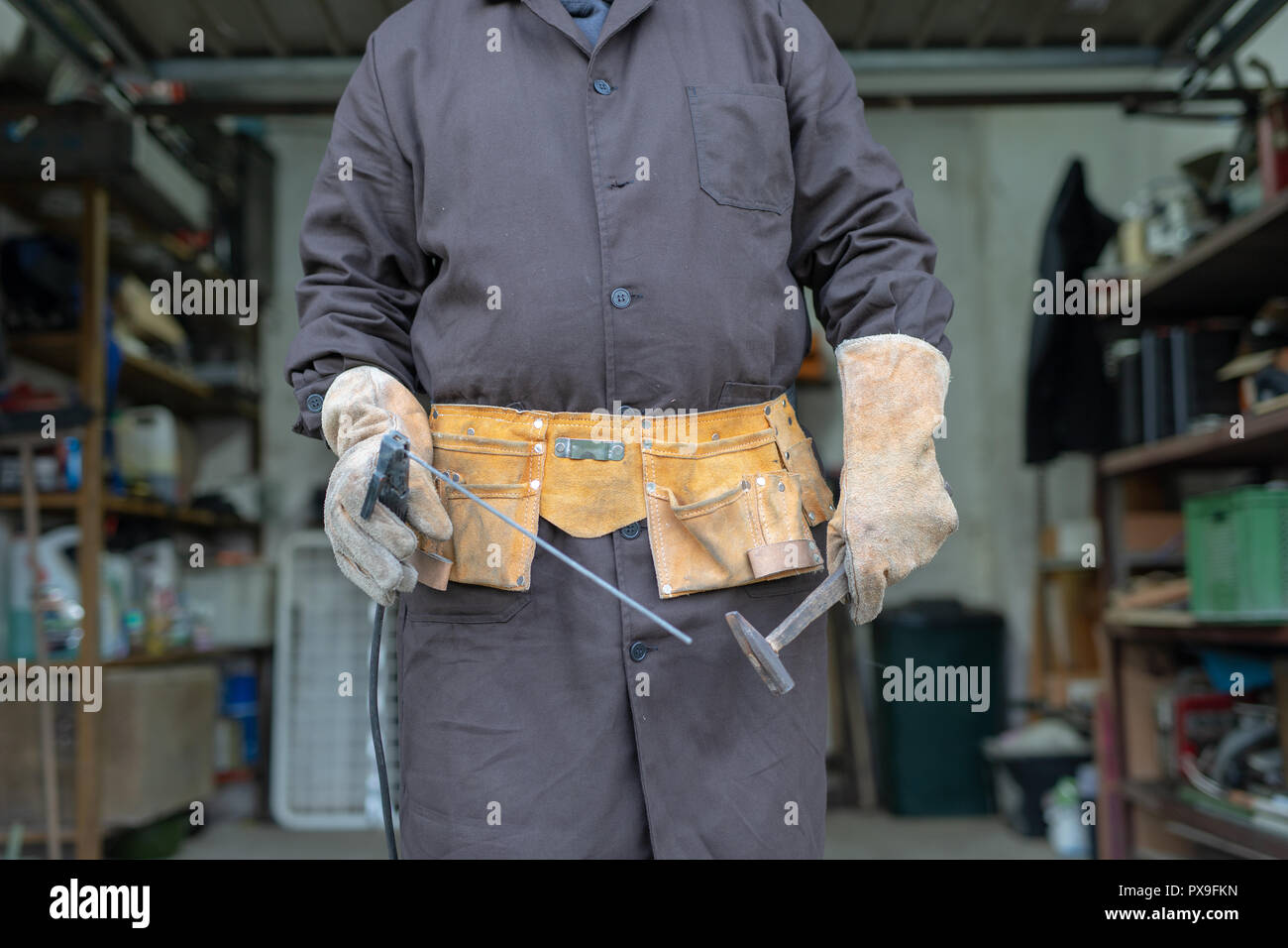 Welder in a mechanical workshop. An employee while working at the ...