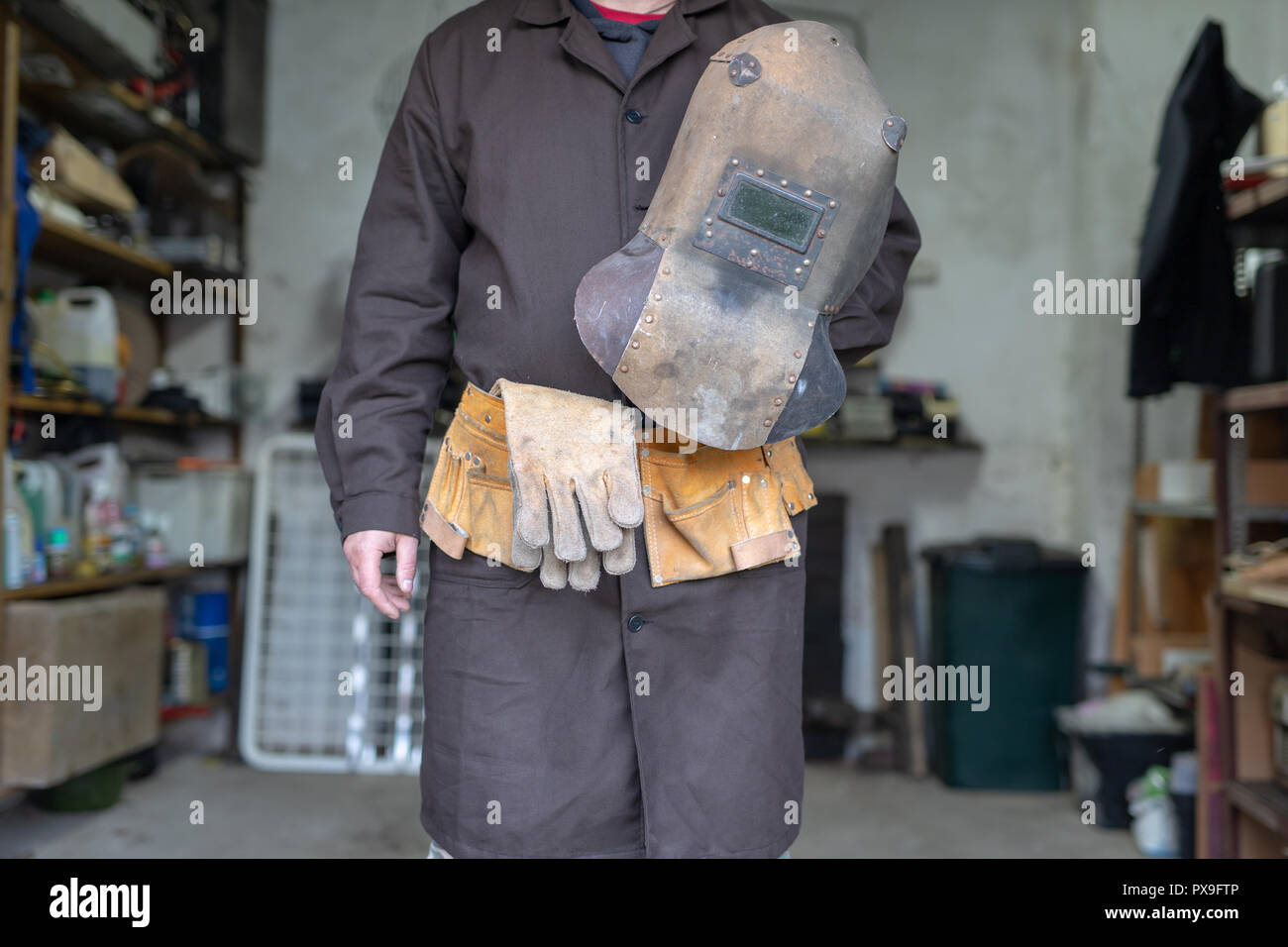 Welder in a mechanical workshop. An employee while working at the ...