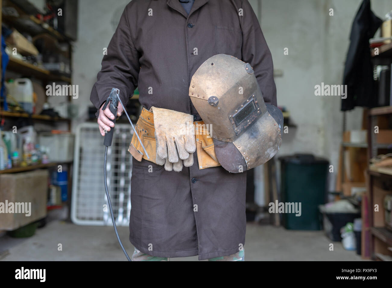 Welder in a mechanical workshop. An employee while working at the ...