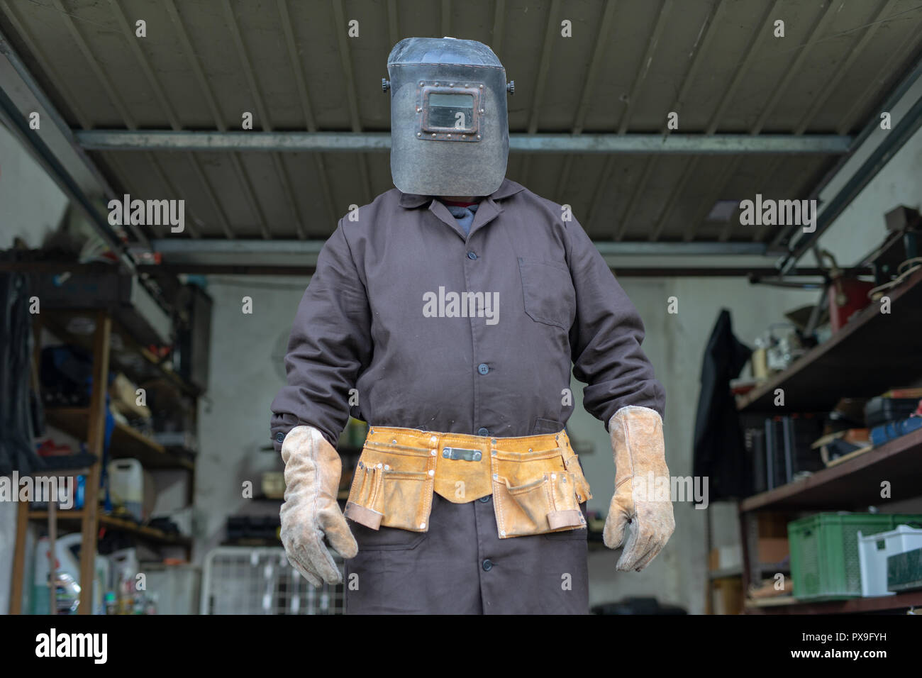Welder in a mechanical workshop. An employee while working at the ...