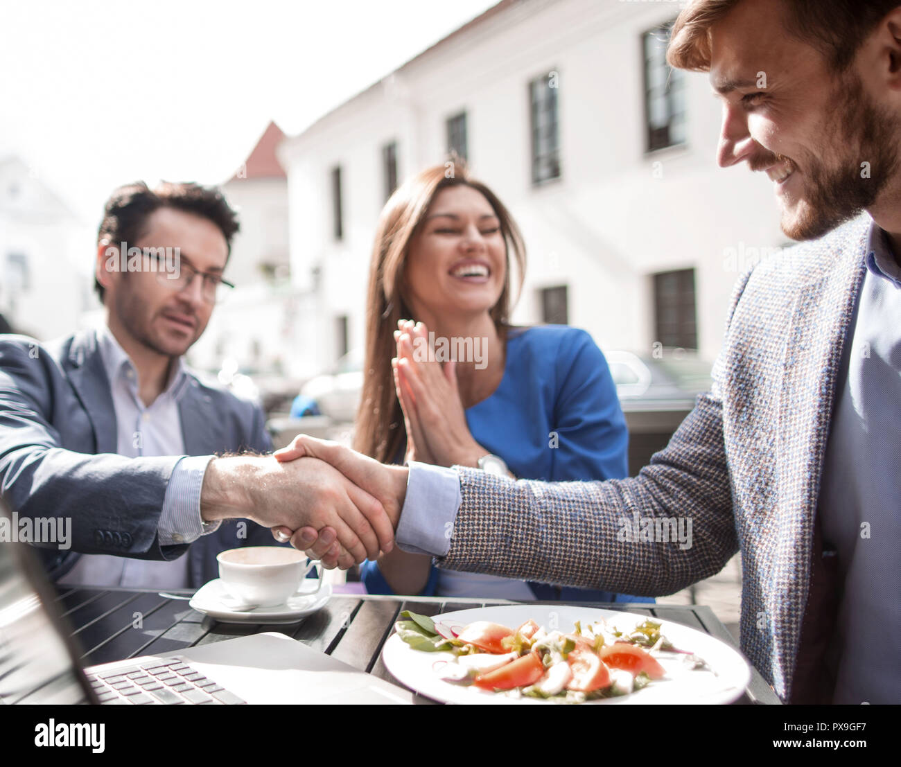 Women handshake restaurant hi-res stock photography and images - Alamy
