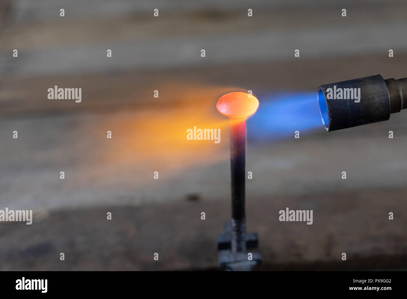 Metal heating with a gas burner in a home workshop. Tempering steel ...