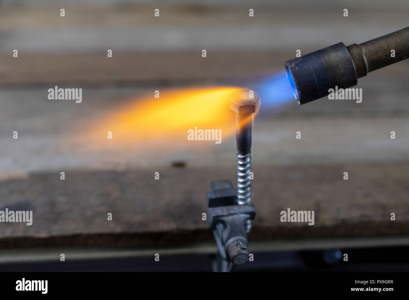 Metal heating with a gas burner in a home workshop. Tempering steel ...