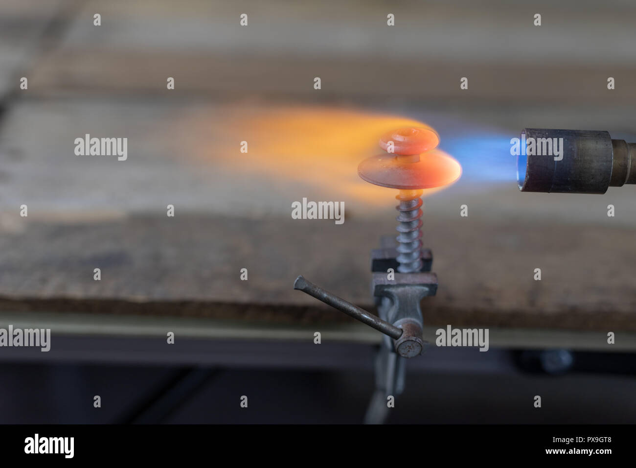 Metal heating with a gas burner in a home workshop. Tempering steel ...