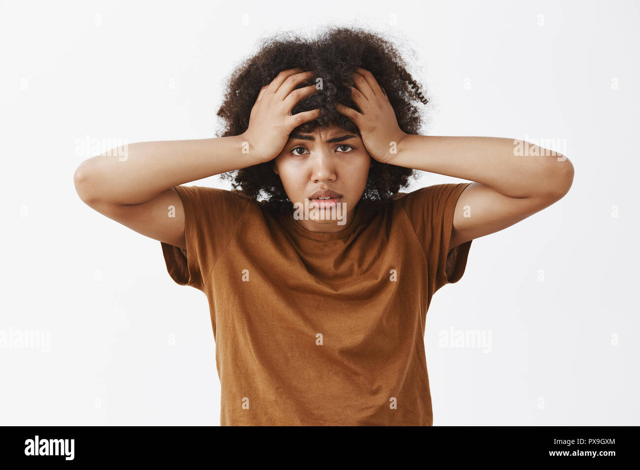 Waist-up shot of bothered and tired depressed african american woman ...