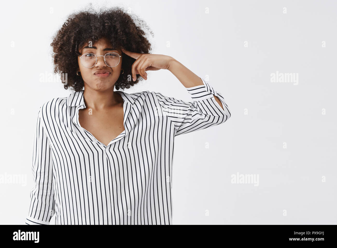 Waist-up shot of dispelased annoyed good-looking woman talking about ...