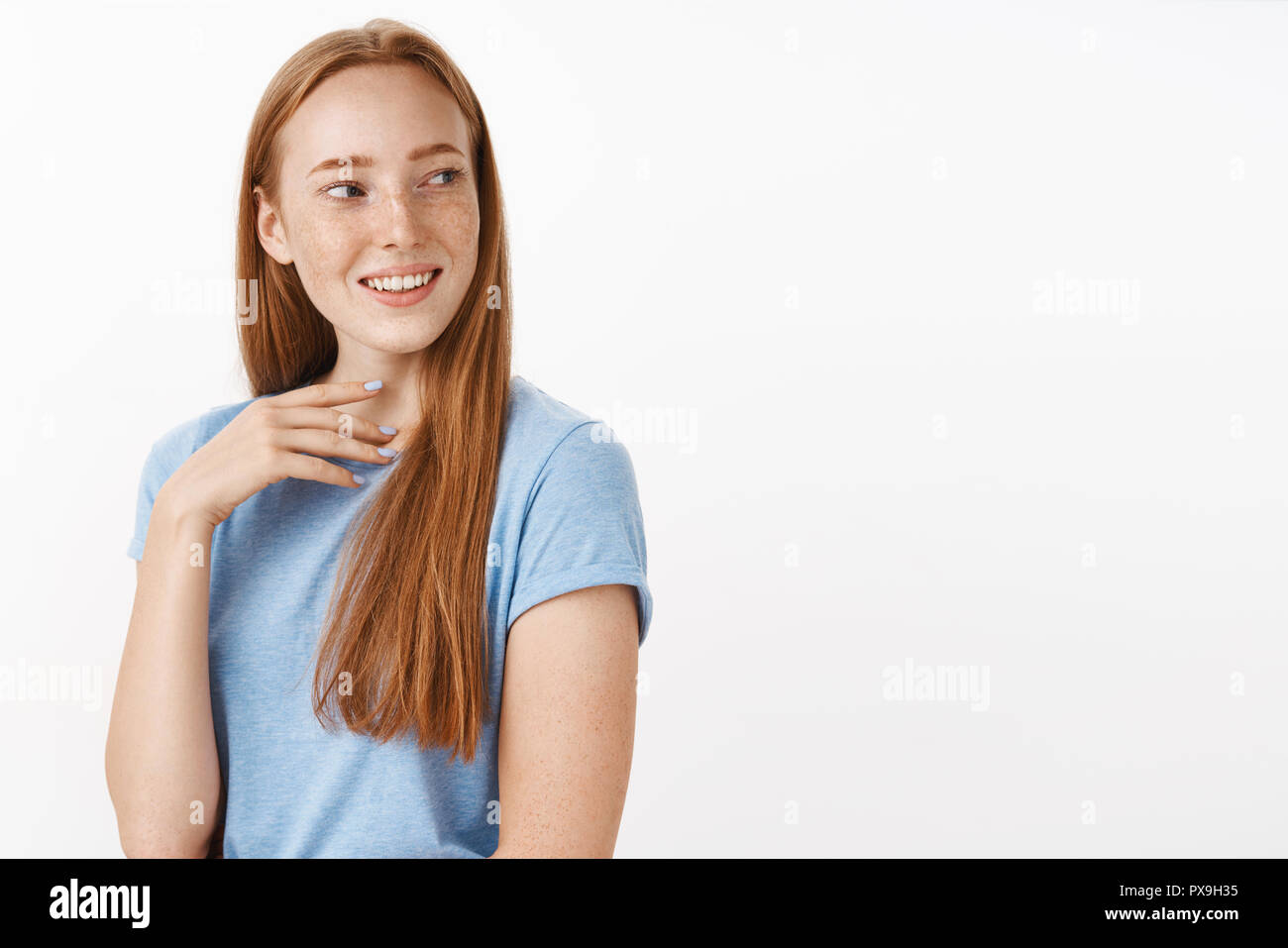 Cute beautiful young redhead woman with natural freckles turning right ...