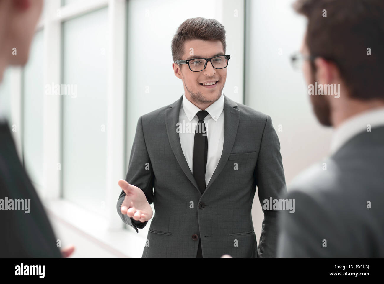 Young confident boss talking employees hi-res stock photography and ...