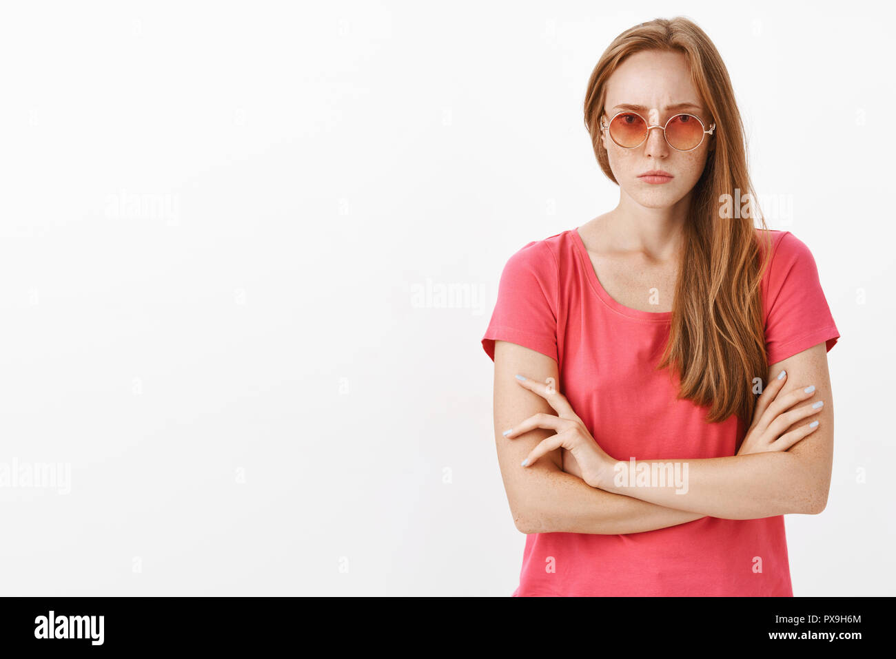 Angry woman waiting explanations. Intense serious-looking displeased ...