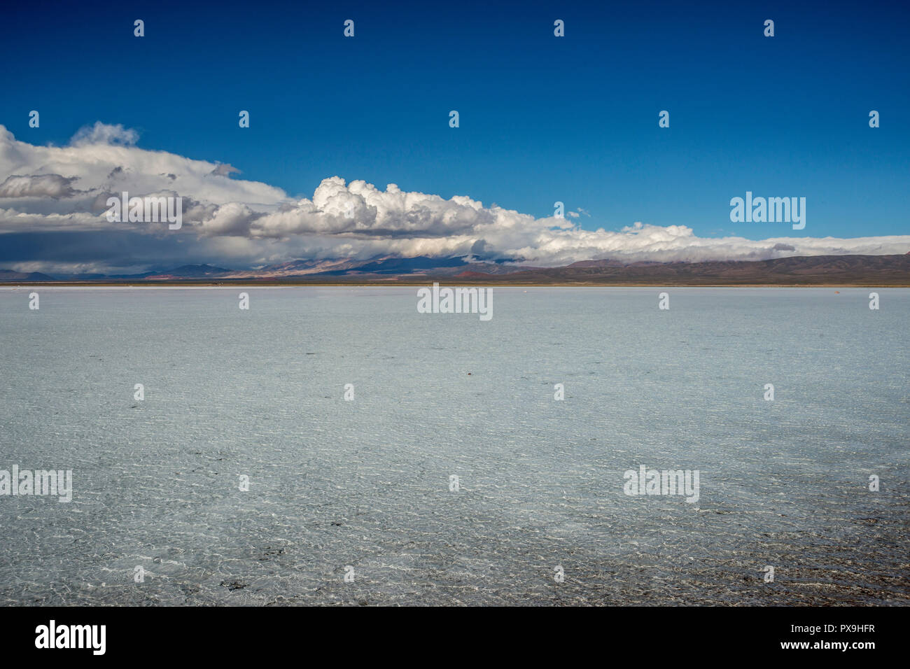 flooded salt in which the sky, clouds and mountains are reflected Stock ...