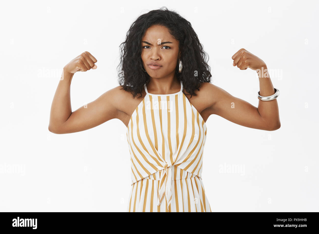 Who say girl weak. Portrait of serious-looking strong and powerful ...