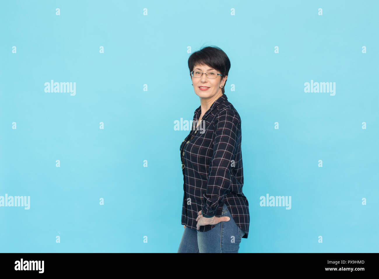 Portrait Of Middle Aged Woman With Short Hair Wearing Glasses Standing 0243