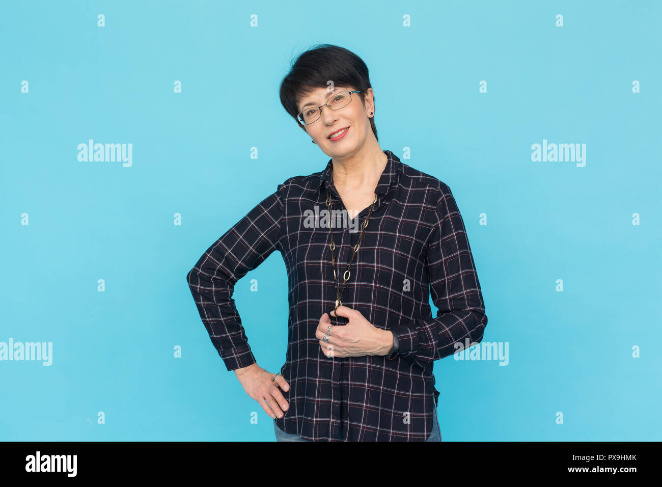 Mid Aged Woman With Short Hair Wearing Glasses And Shirt Standing 9368