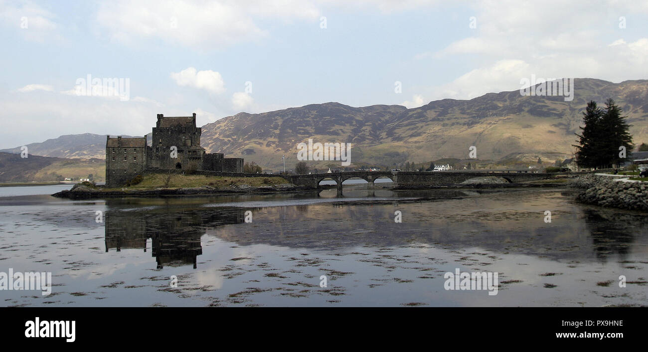 The 13th century Scottish castle, Eilean Donan, sits on a small island ...