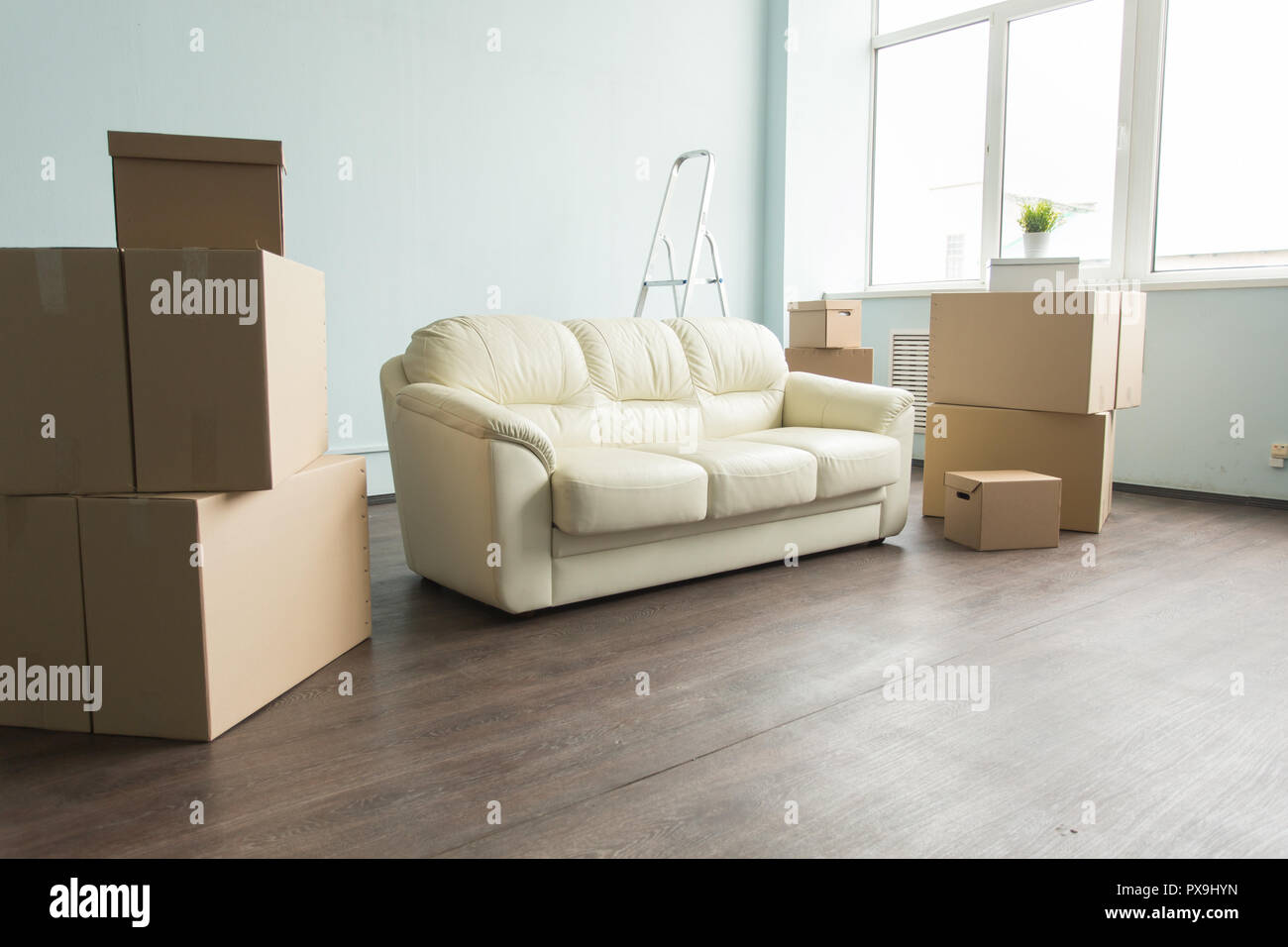Empty room full of cardboard boxes for moving into a new home Stock ...