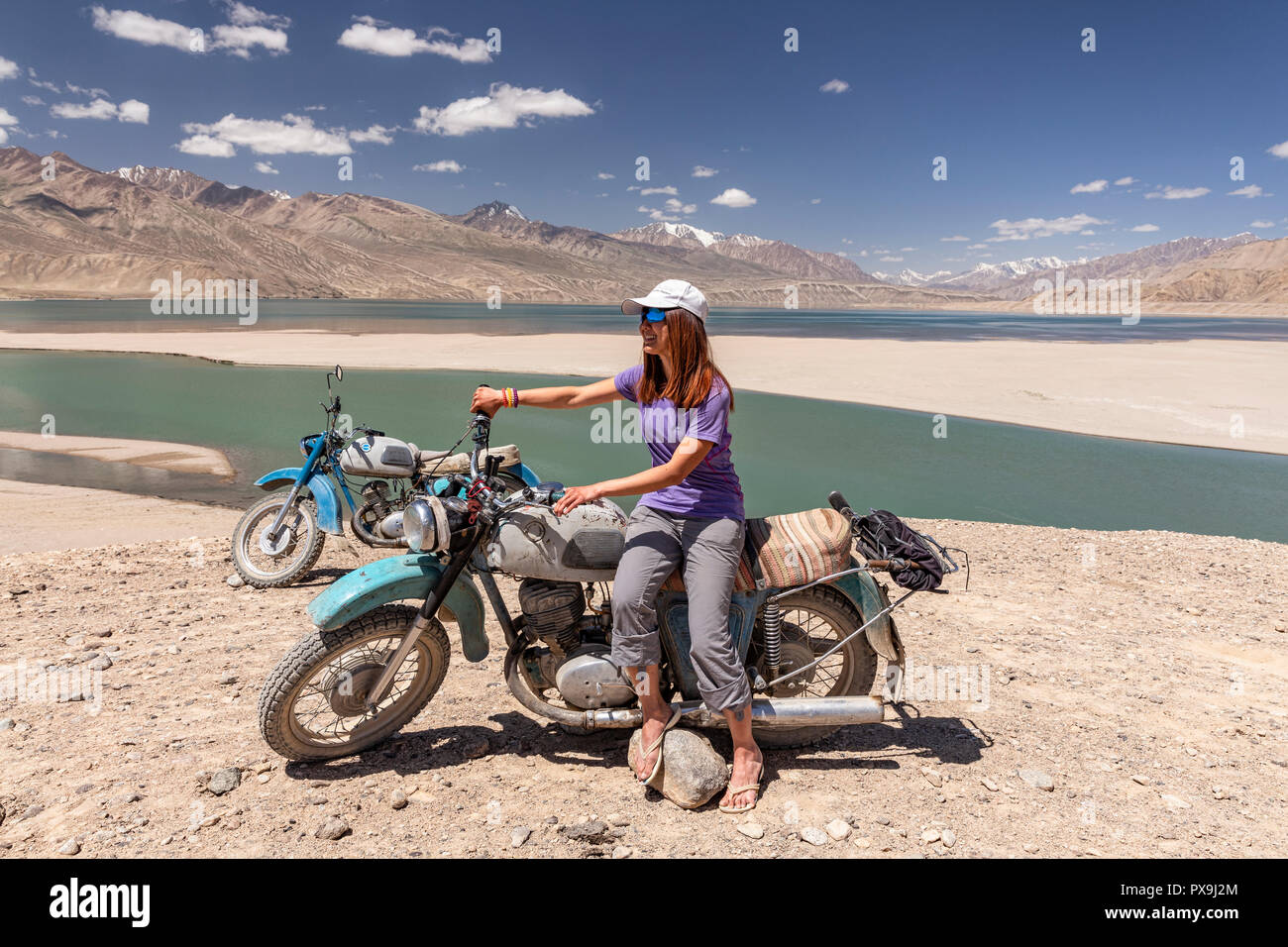 Checking out a couple of old Russian motorcycles parked at Yashikul ...