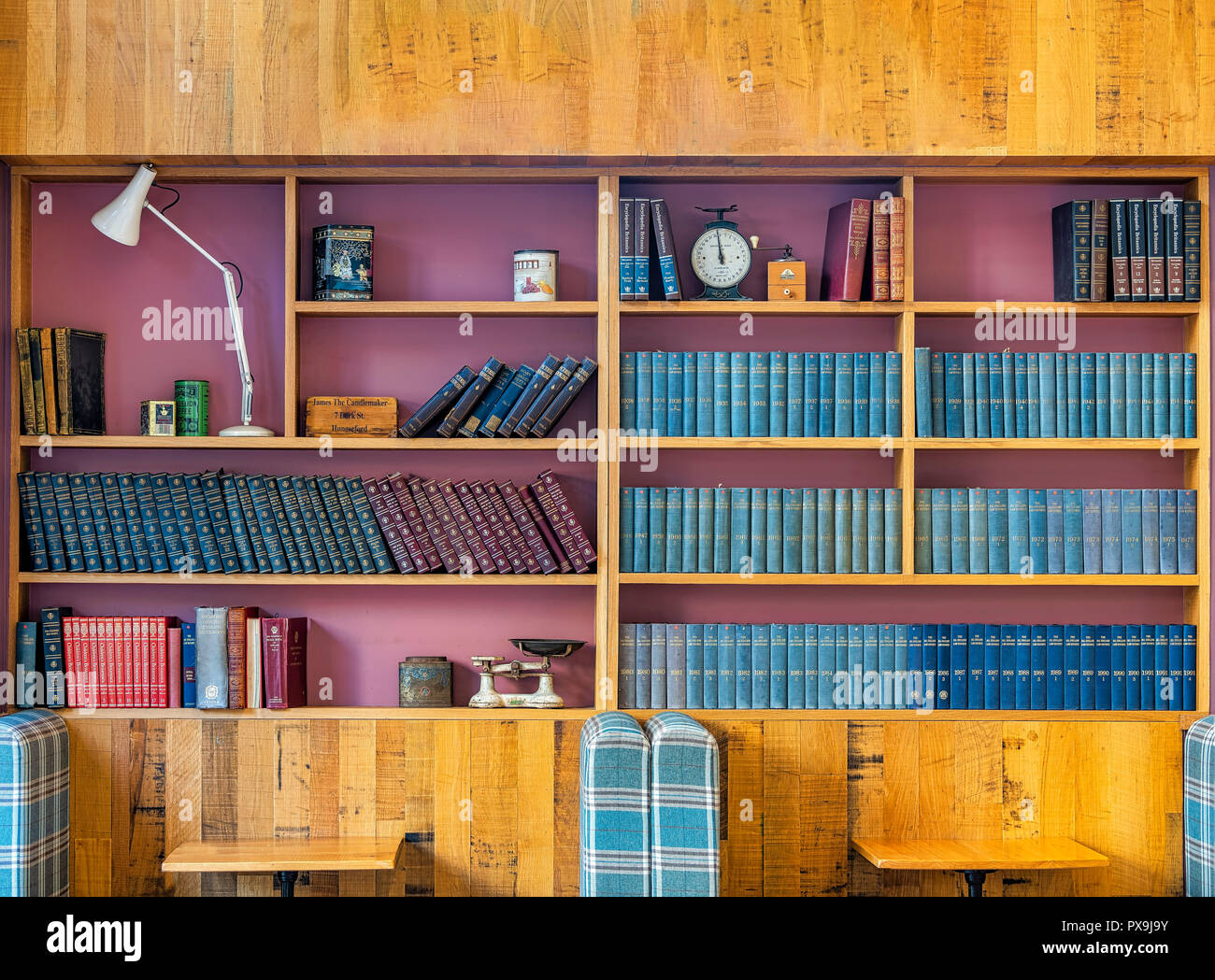 A Classic Bookshelf with Antiques on display Stock Photo - Alamy