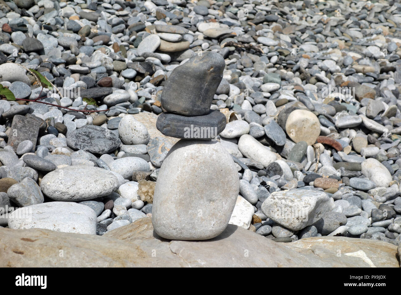 Three Stones Balancing on Top of One Another on a Shingle Beach near ...