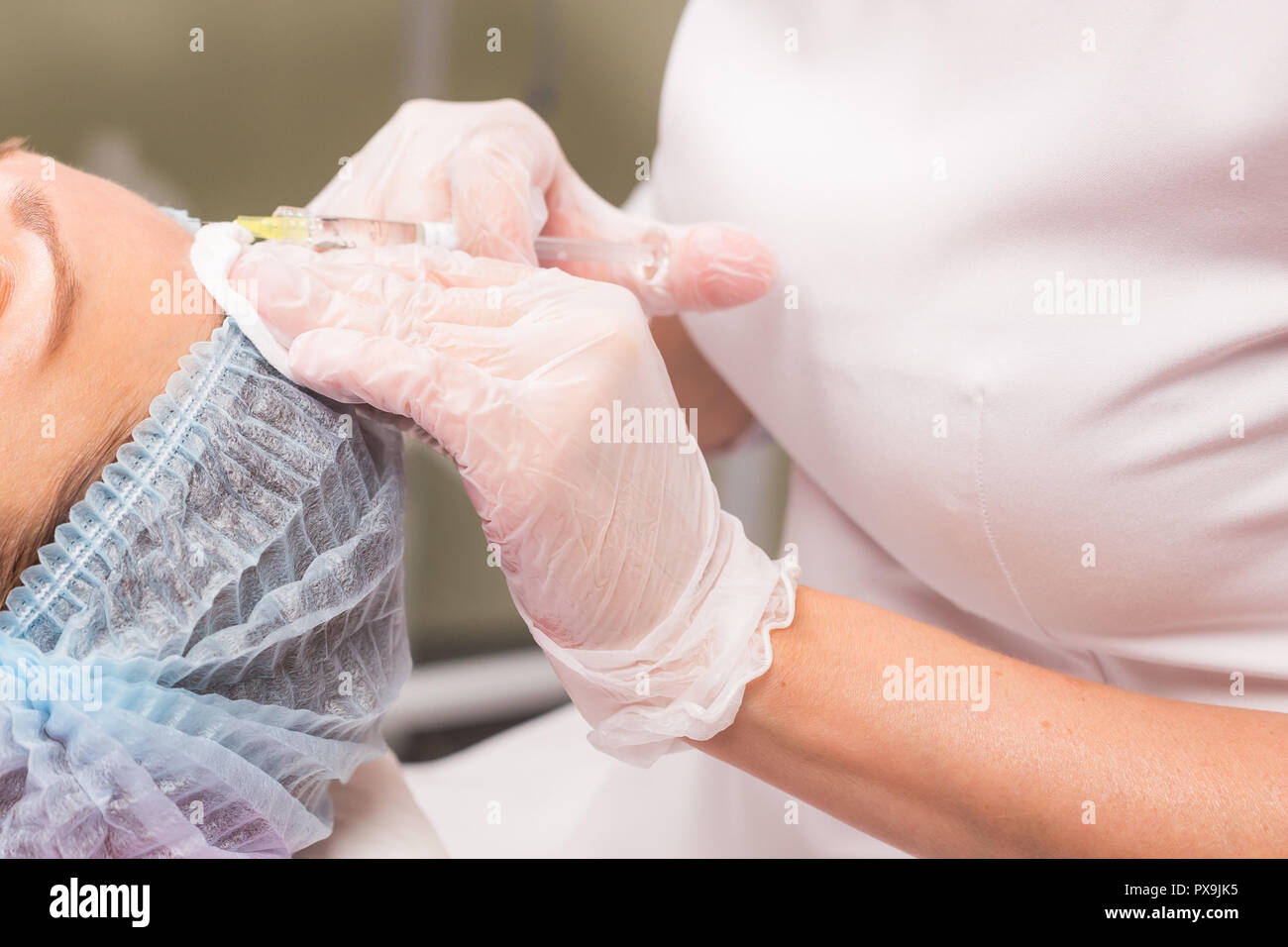 People and cosmetology concept - Close up of hands of expert beautician ...