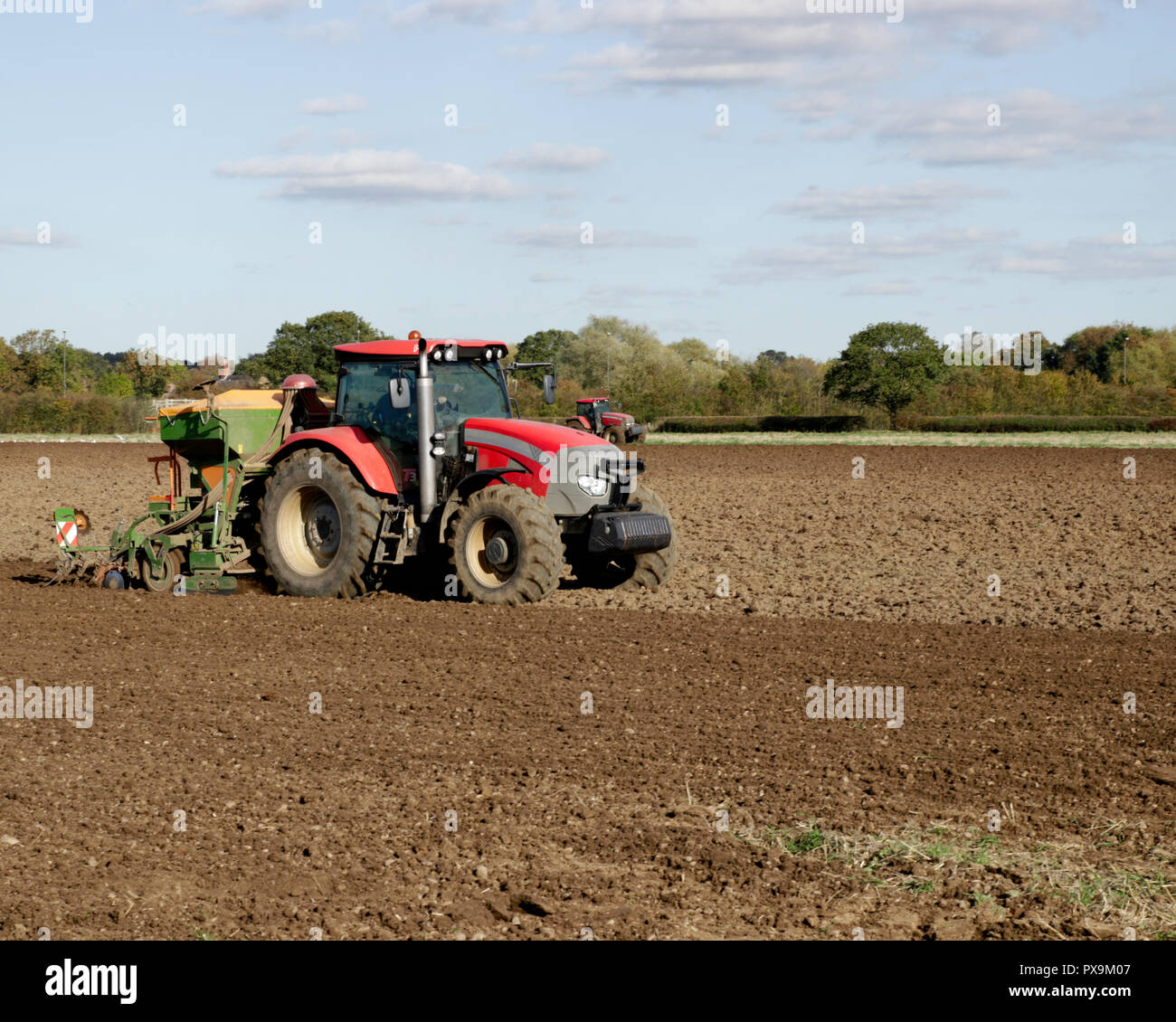 Tractors Setting Seed in the Field Stock Photo - Alamy
