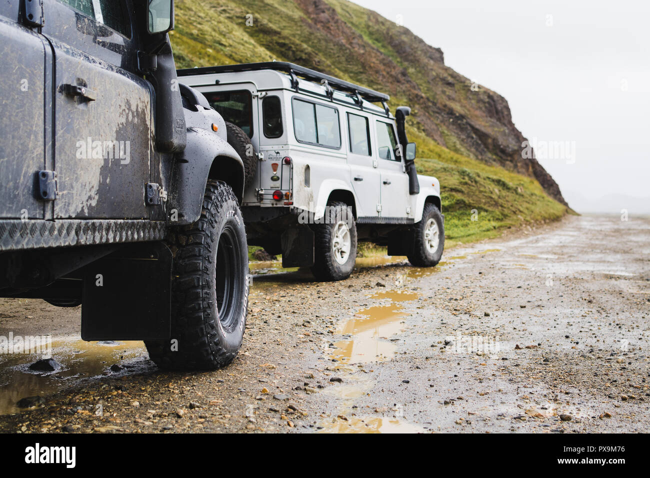 LANDMANNALAUGAR, ICELAND - AUGUST 2018: two offroad cars on the mud ...