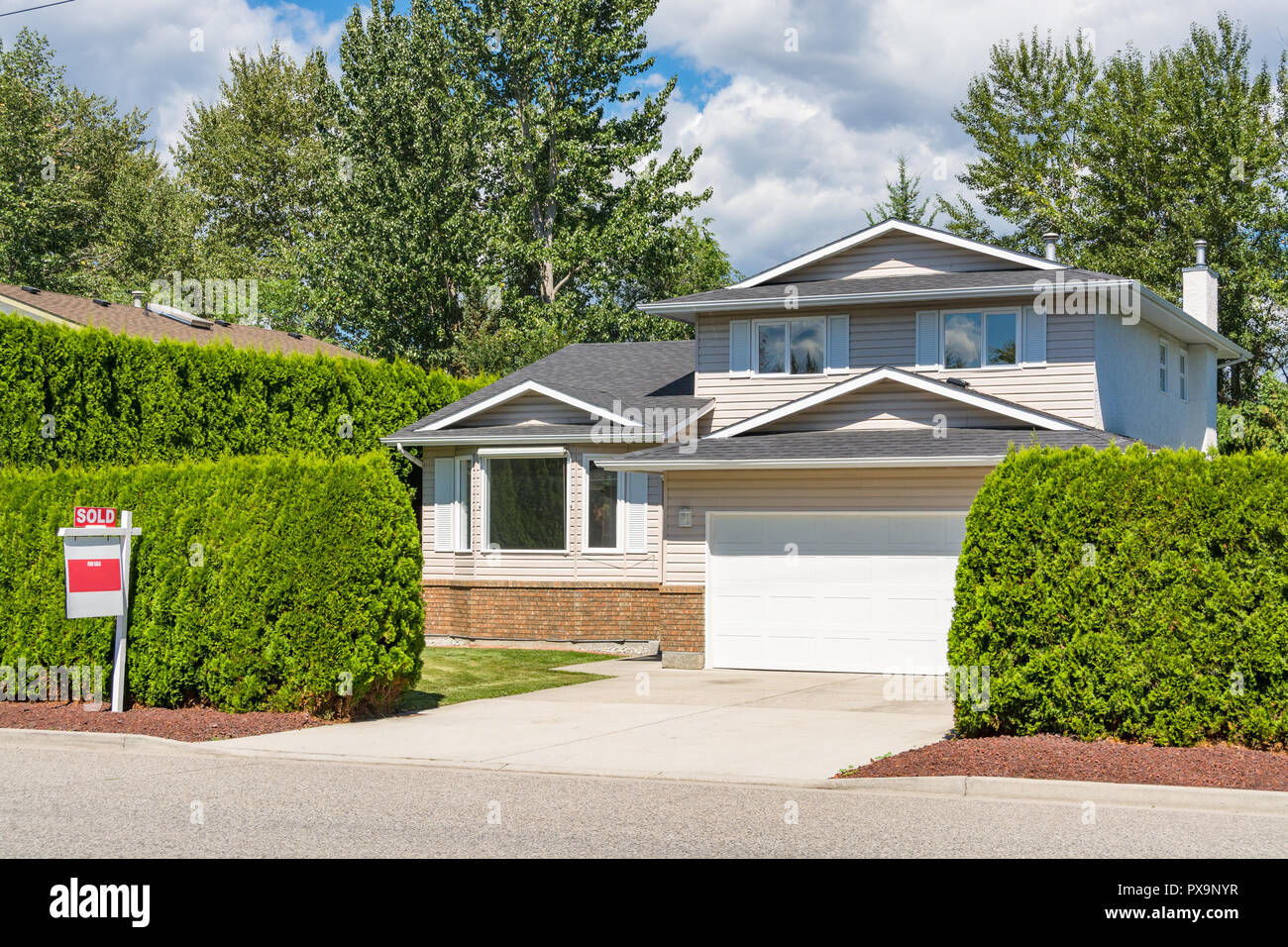 A perfect neighbourhood. Main entrance of big residential house with ...