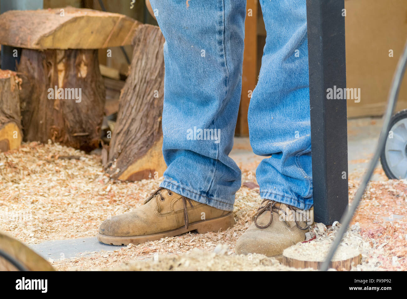 Man standing is saw dust working Stock Photo - Alamy