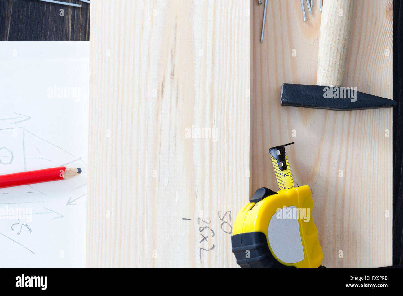 board, drawing on paper from a birdhouse and building tools for its ...