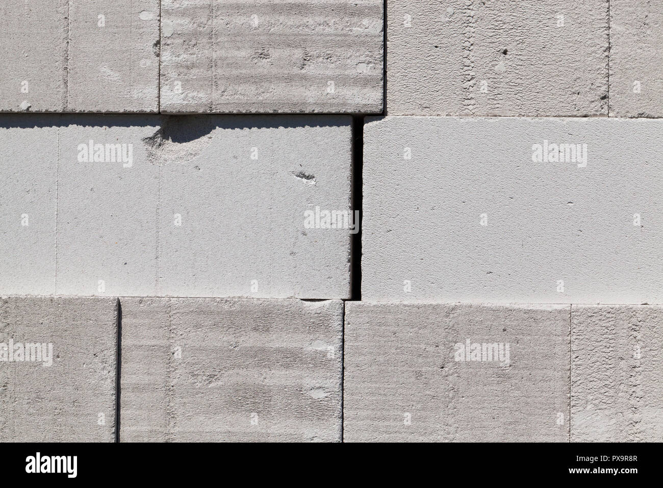 folded together large blocks of white or gray, used in construction ...