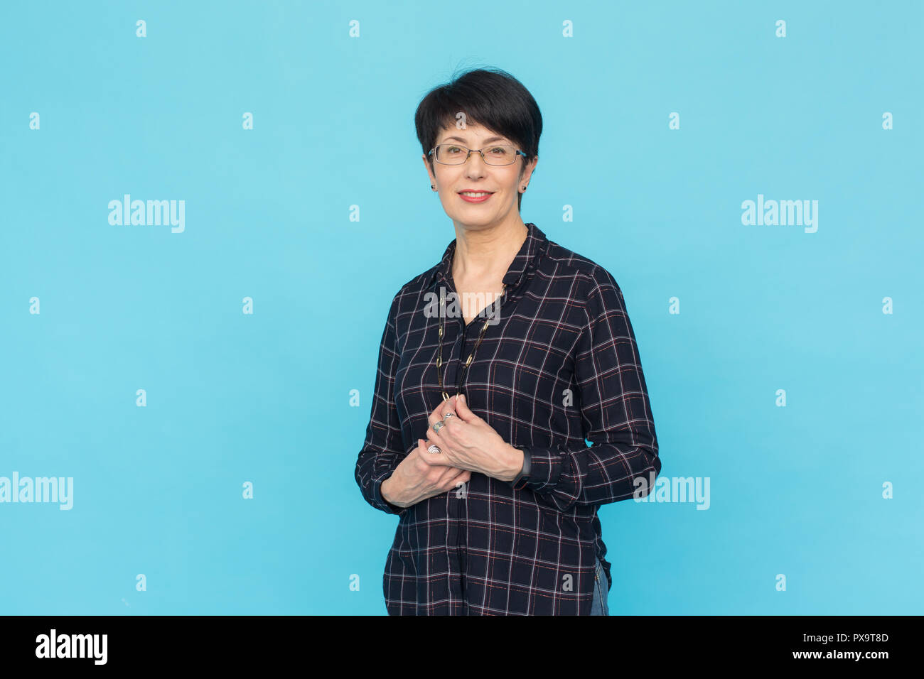 Mid Aged Woman With Short Hair Wearing Glasses And Shirt Standing 3651