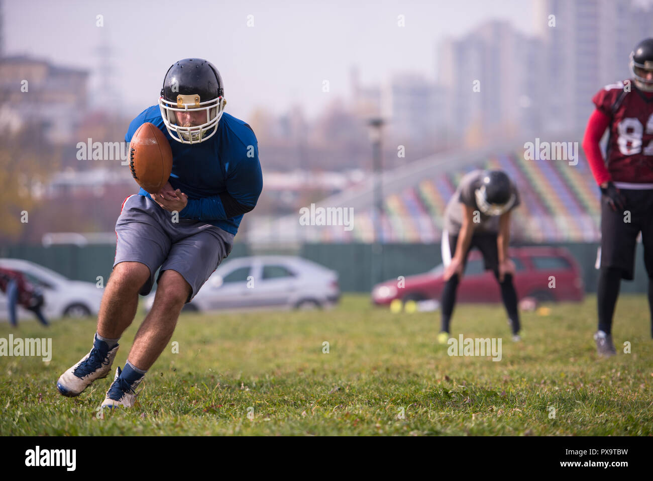 group of young american football players in action during the training ...