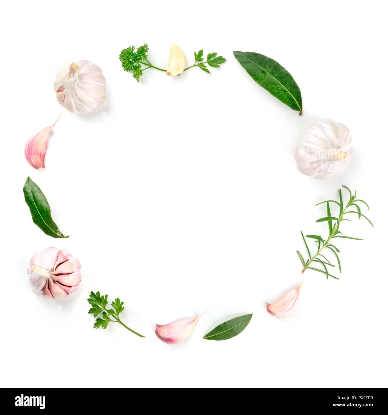 An overhead photo of a frame with garlic and herbs with a place for ...