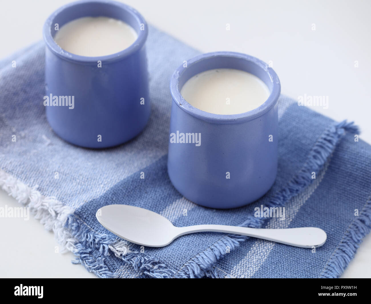 Natural yogurt in blue jars Stock Photo - Alamy
