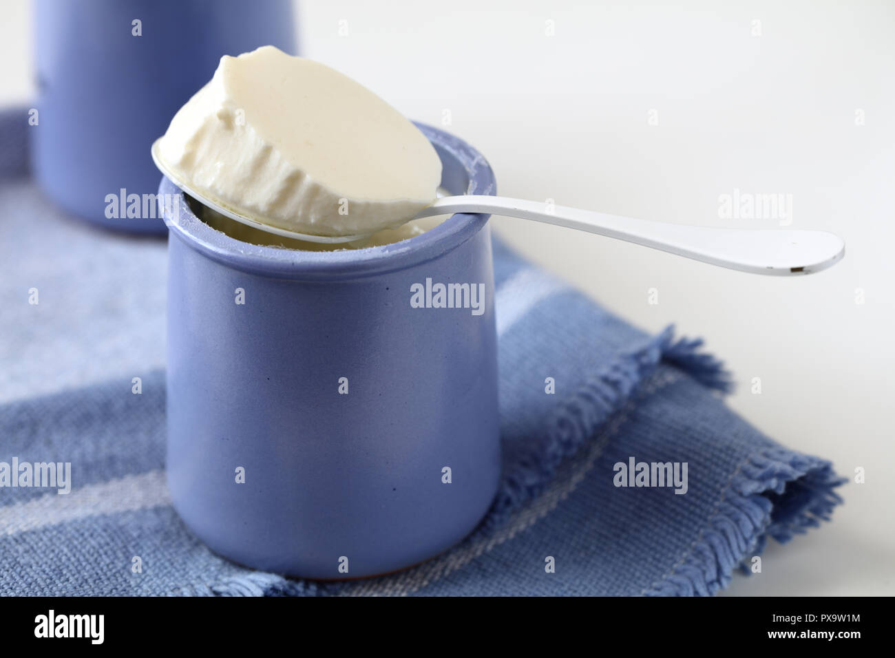 Natural yogurt in blue jars Stock Photo - Alamy
