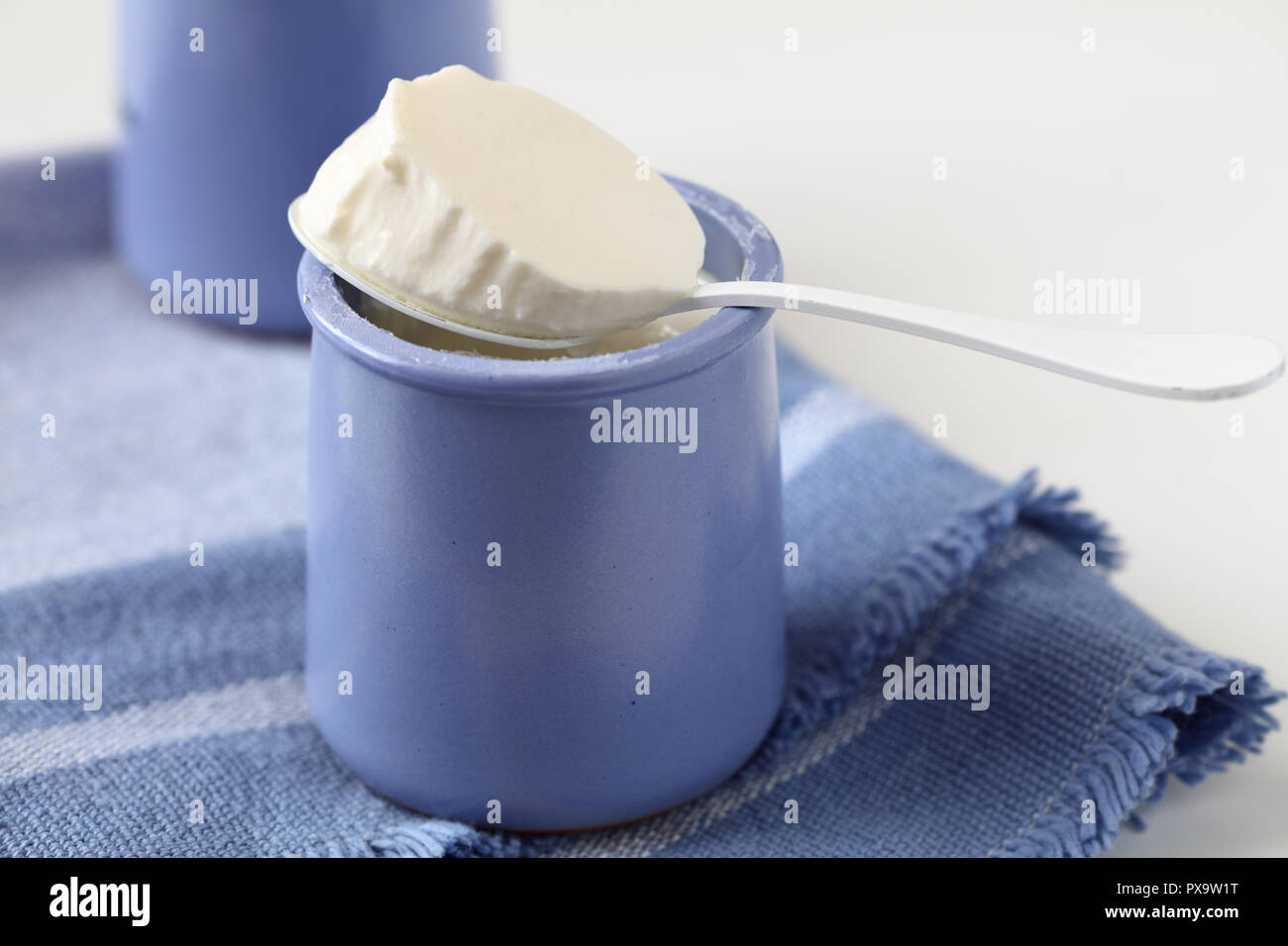 Natural yogurt in blue jars Stock Photo - Alamy