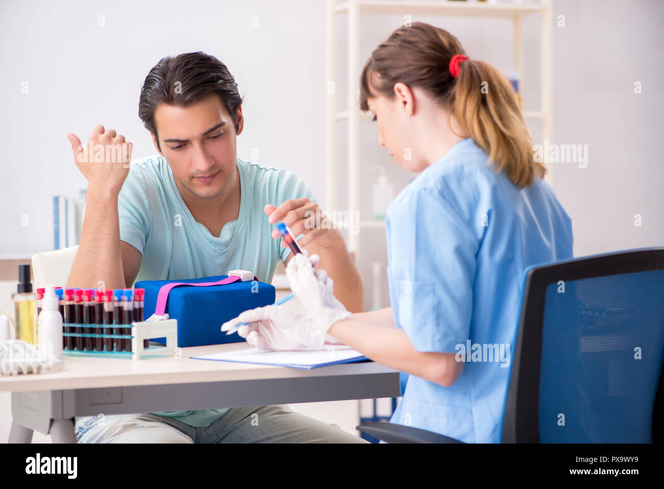 Young patient during blood test sampling procedure Stock Photo - Alamy