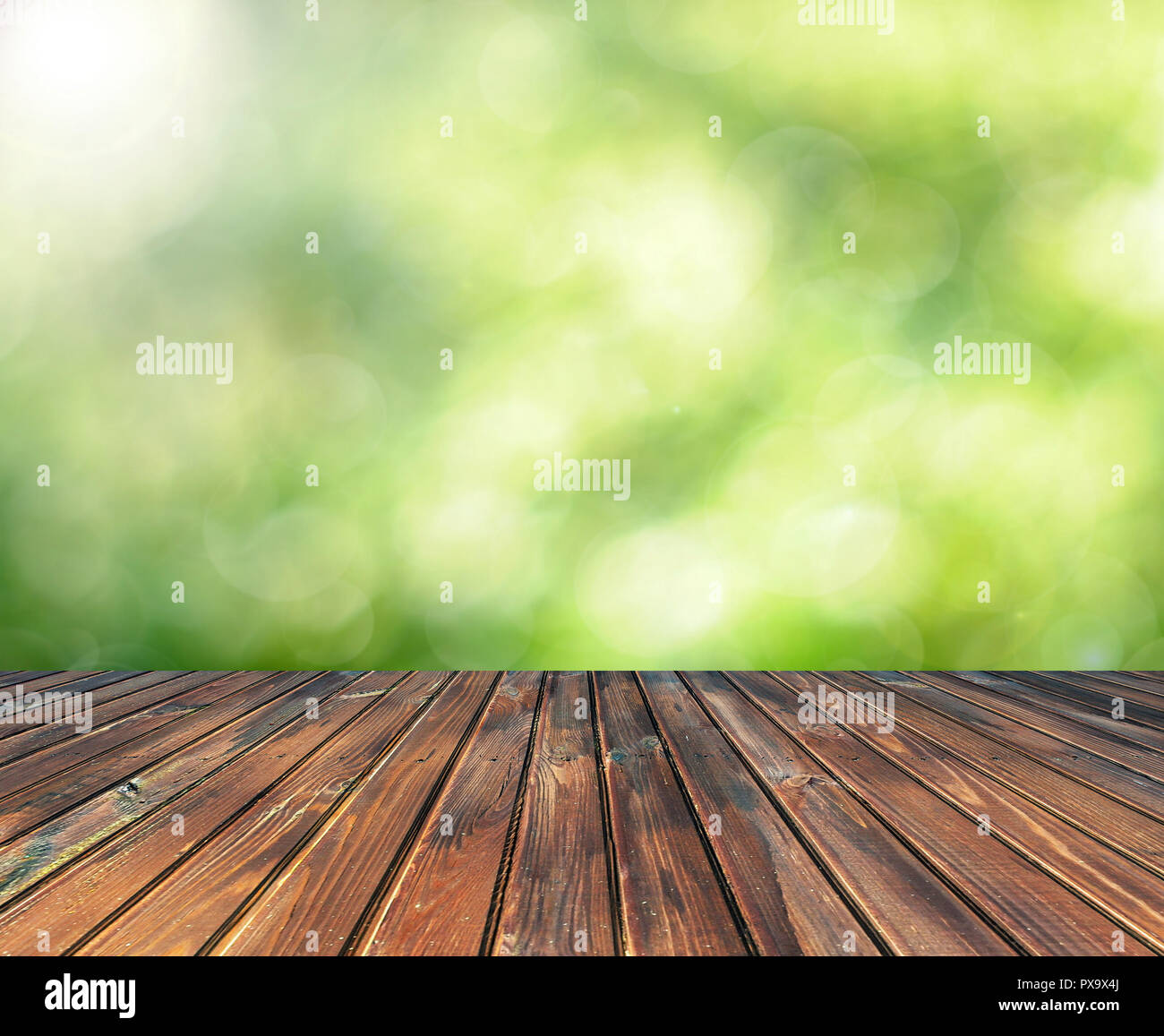 wooden table with space for your photo montage and green color of ...