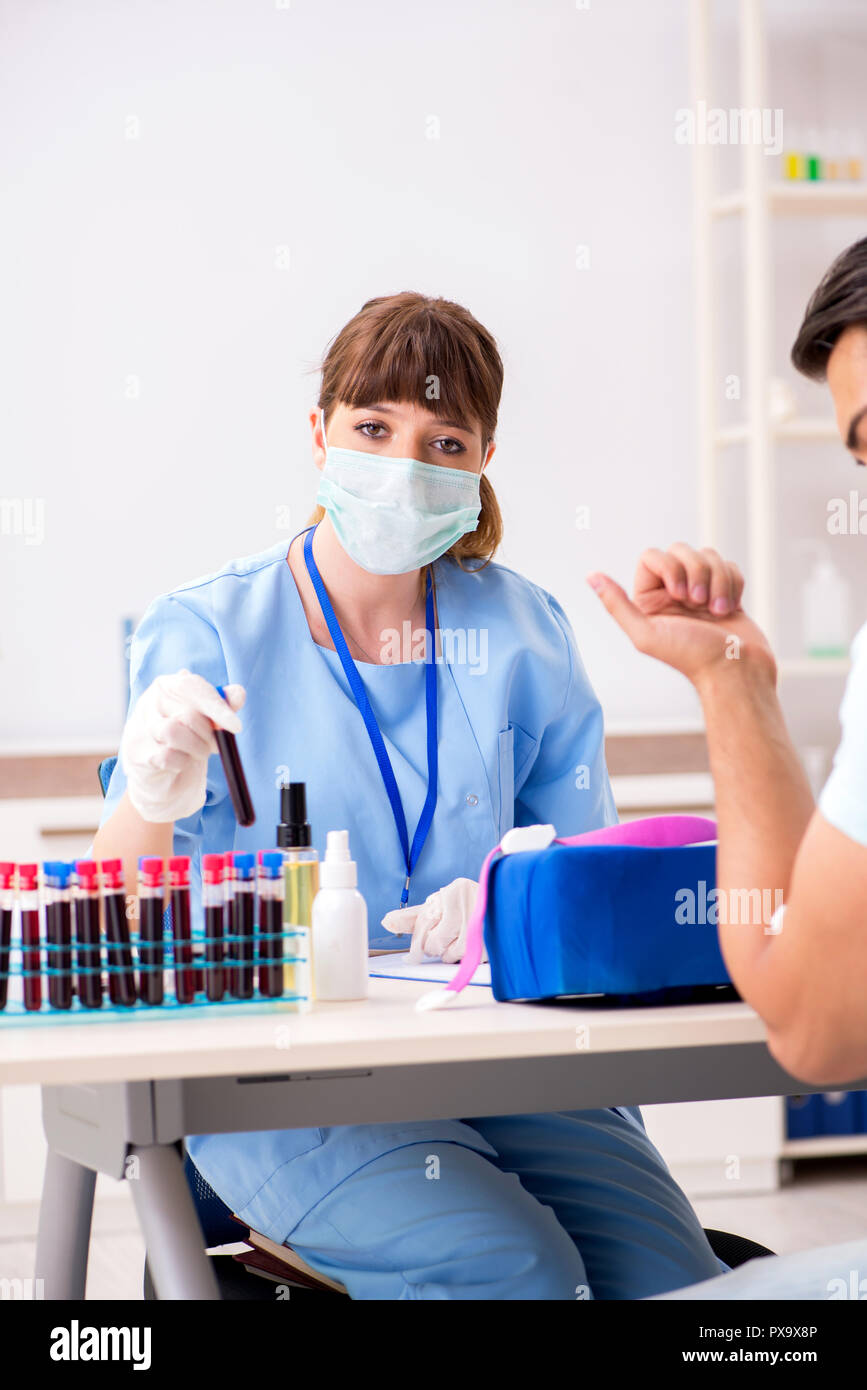 Young patient during blood test sampling procedure Stock Photo - Alamy