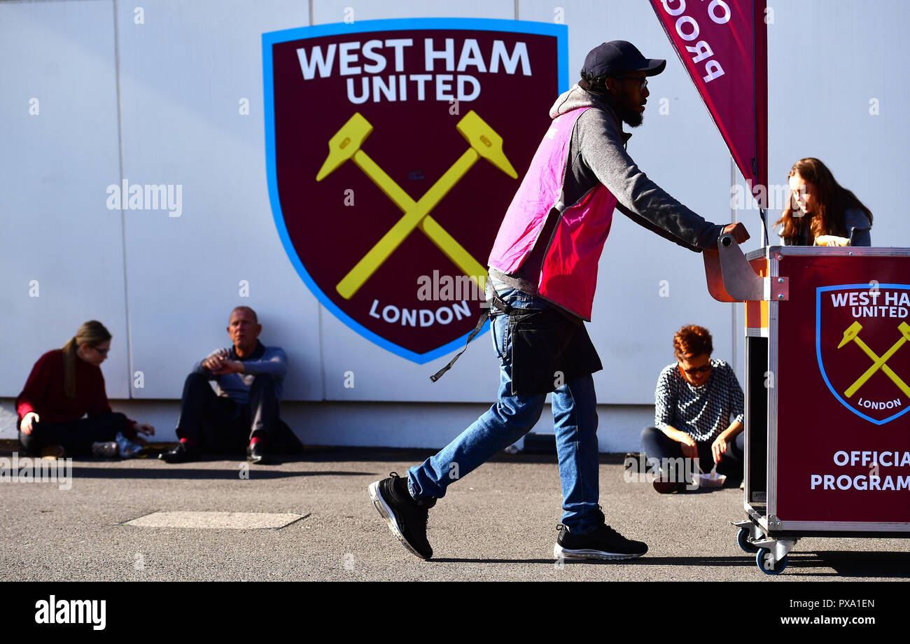 A vendor sells the match day programme during the Premier League match ...
