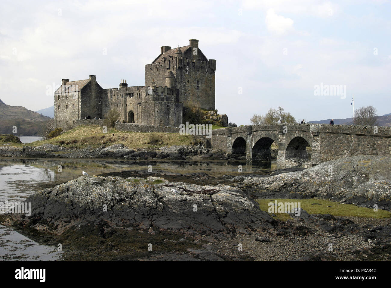 The 13th century Scottish castle, Eilean Donan, sits on a small island ...