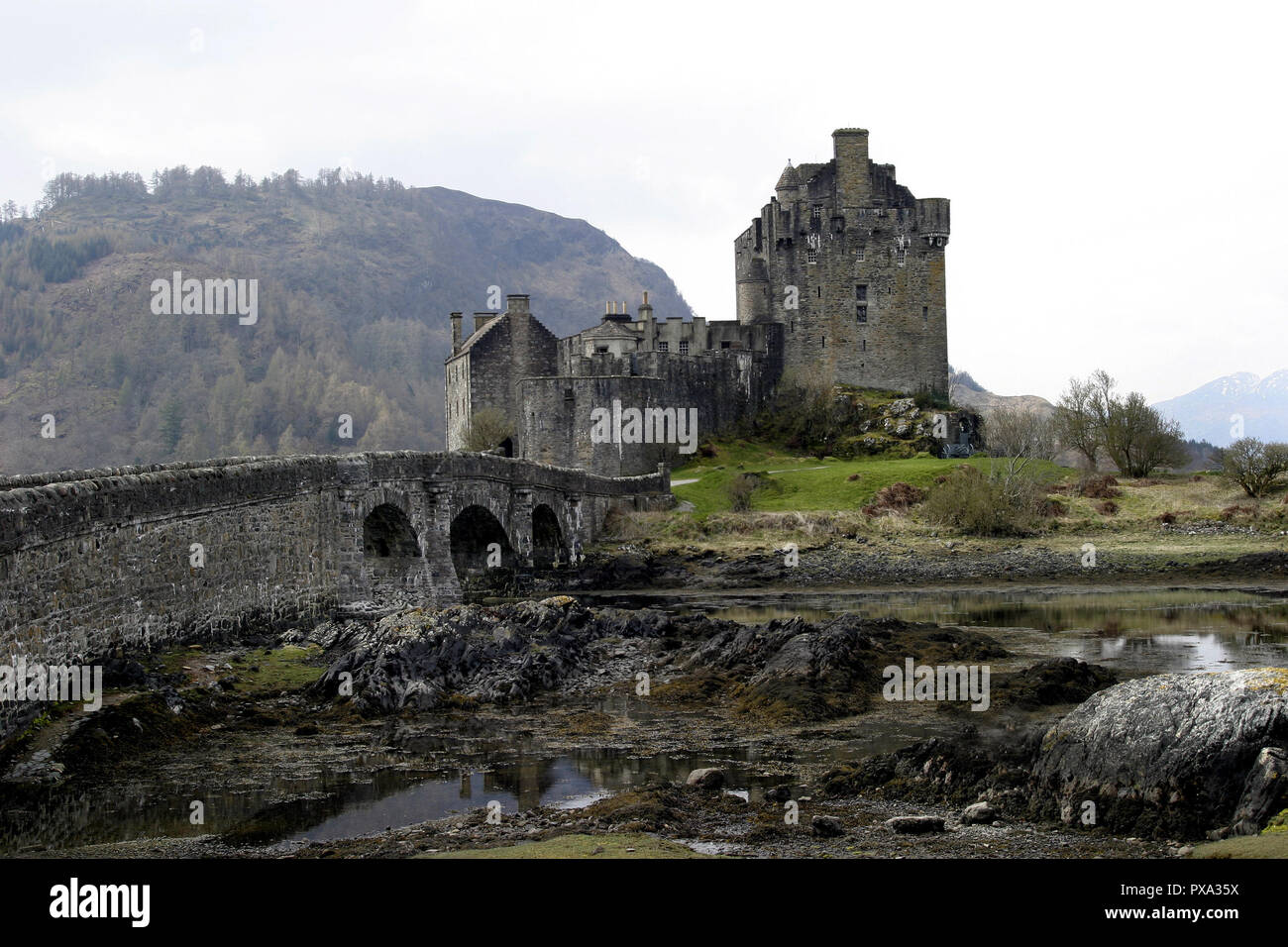The 13th century Scottish castle, Eilean Donan, sits on a small island ...