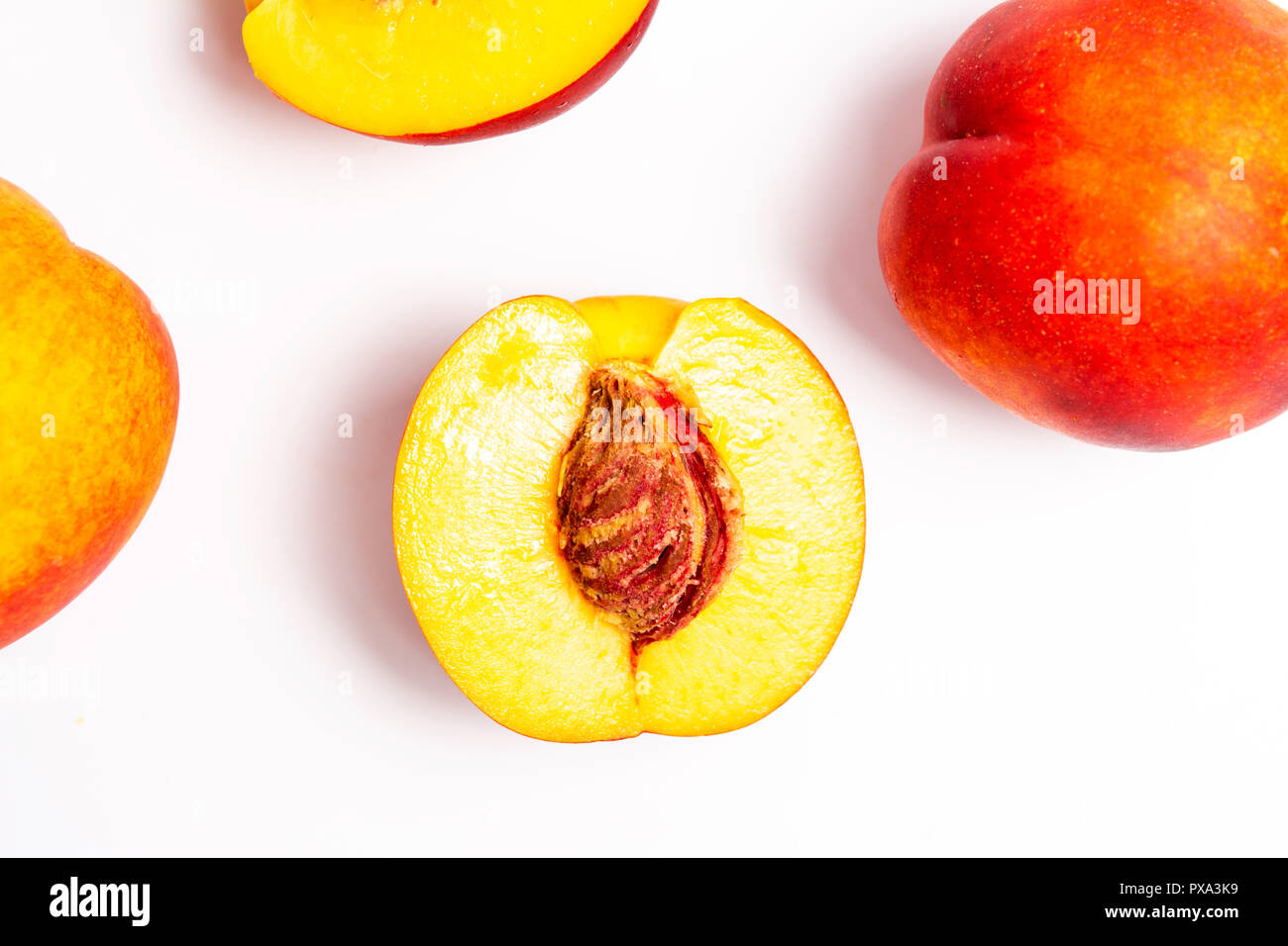 Fresh red peach on white background top view Stock Photo - Alamy