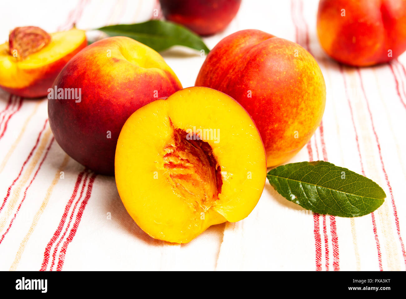Fresh red peach on a table top view Stock Photo - Alamy