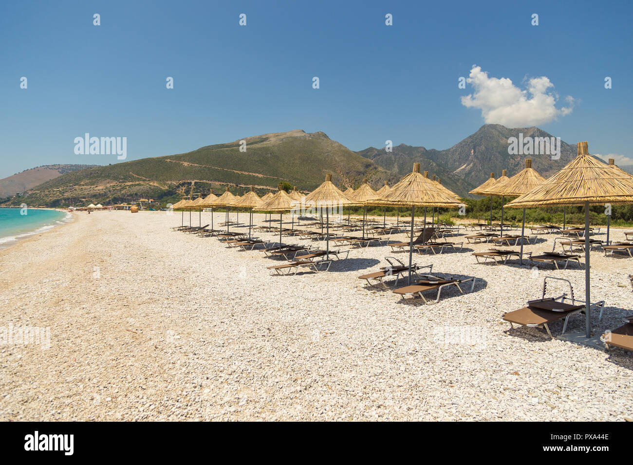 Umbrellas on the Borsh Beach in Albania. Stony beach on the Adriatic ...